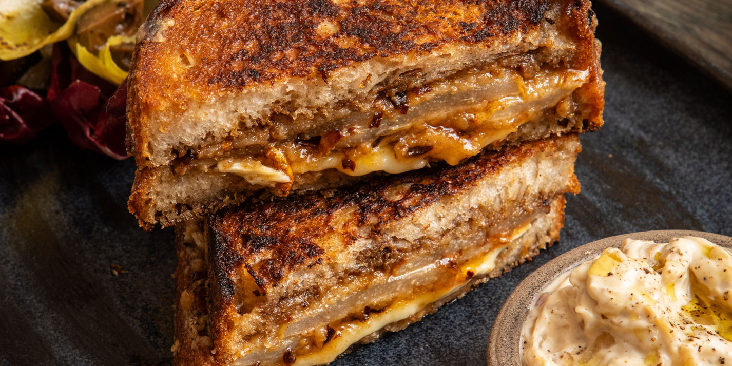 Buttered pear, brie and manchego toastie with onion crème fraîche ...